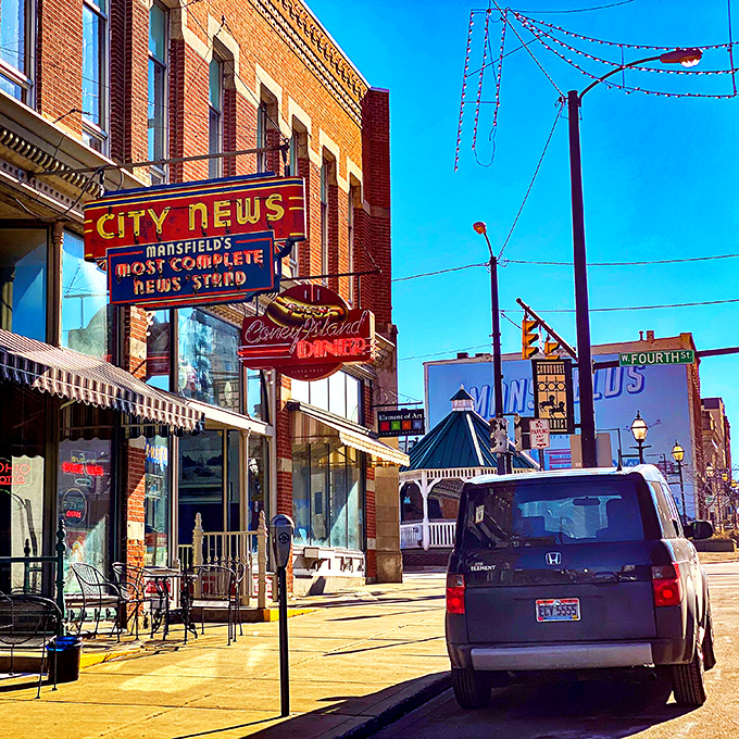 That iconic neon hot dog sign isn't just illuminating North Main Street—it's beckoning you toward breakfast nirvana in downtown Mansfield.