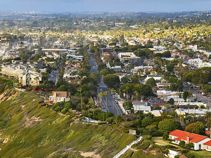 Beachfront paradise meets suburban dream in this aerial view of Encinitas, where the Pacific kisses the coastline like an old friend returning home.