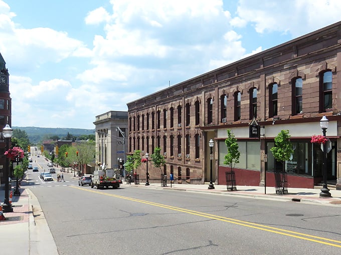 Historic charm meets small-town warmth on Marquette's Washington Street, where sandstone buildings whisper stories of the past while housing today's vibrant businesses.