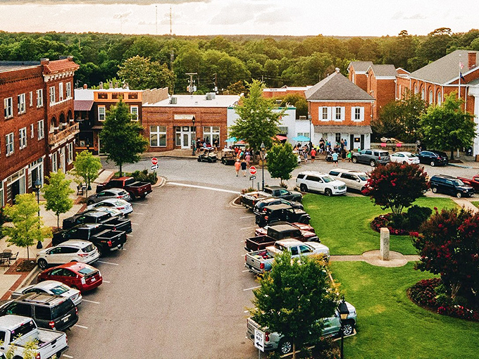 Edgefield's town square at golden hour looks like a Norman Rockwell painting come to life, where brick buildings and green spaces create the perfect small-town symphony.