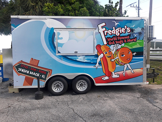 That cheerful blue food truck isn't just transportation &ndash; it's a mobile temple of hot dog happiness.