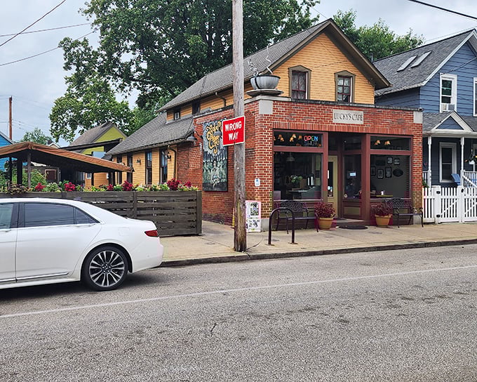 The charming brick-and-yellow exterior of Lucky's Cafe stands like a beacon of breakfast hope in Cleveland's Tremont neighborhood.