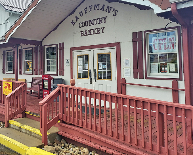 The charming exterior of Kauffman's Country Bakery welcomes visitors with its classic red-trimmed porch and rustic wooden railings—Amish Country's version of a sweet-tooth embassy.