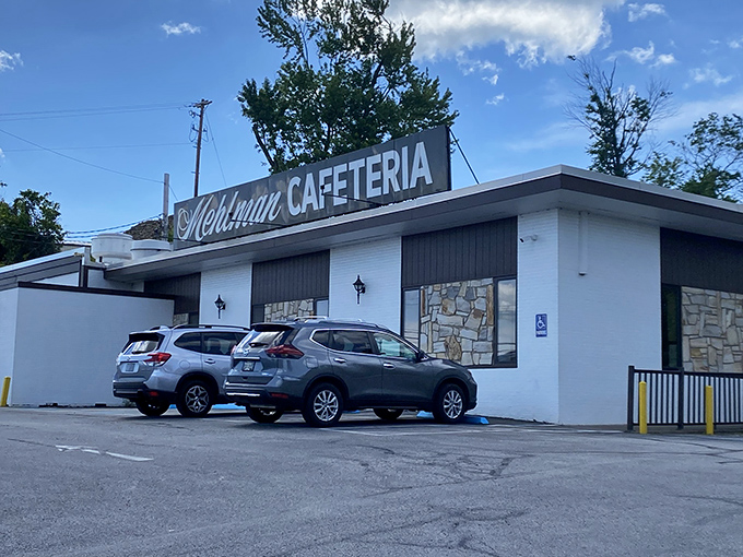 The unassuming white exterior of Mehlman's Cafeteria stands like a culinary time capsule, promising comfort food treasures that no trendy bistro could match.