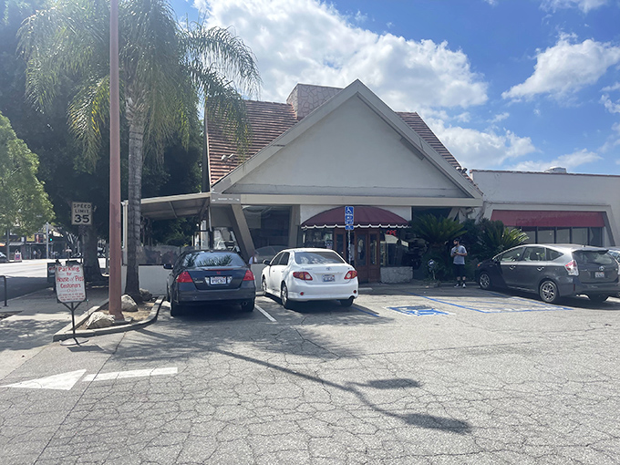 The iconic A-frame roof of House of Pies stands like a beacon of comfort on Los Feliz Boulevard, promising sweet salvation to weary Angelenos 24/7.