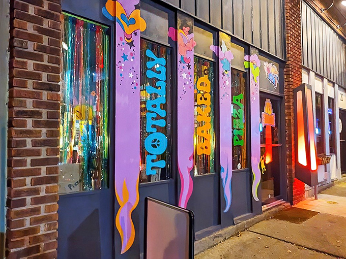 The psychedelic storefront of Totally Baked Pizza looks like the 1970s and 2020s had a delicious love child on Akron's High Street.
