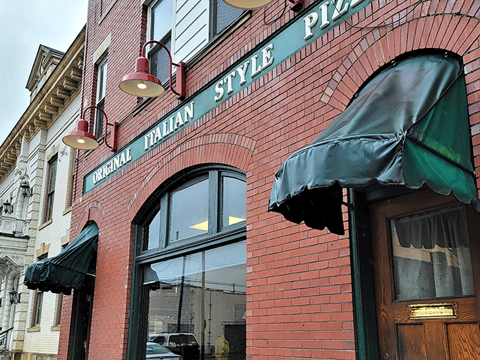 The iconic brick fa&ccedil;ade with green awnings doesn't scream "food destination," but locals know this unassuming storefront houses pizza worth committing minor traffic violations for.