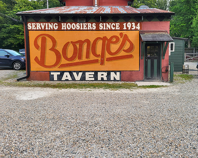 The iconic coral-colored exterior of Bonge's Tavern stands like a culinary lighthouse in rural Indiana, beckoning hungry travelers with its vintage charm and legendary reputation.