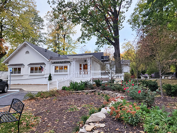 The unassuming white farmhouse exterior of Hollyhock Hill stands like a time capsule of Midwestern dining, promising comfort food treasures within.