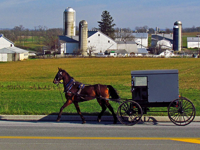 Where modern meets traditional &ndash; Amish buggies share the road with cars as they have for generations at Strasburg's iconic entrance.