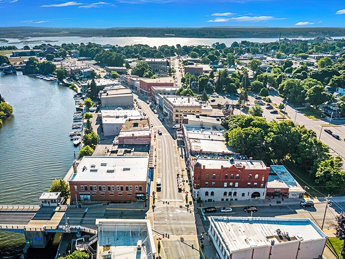 Downtown Manistee spreads along the river like a perfectly arranged postcard that forgot to charge admission.