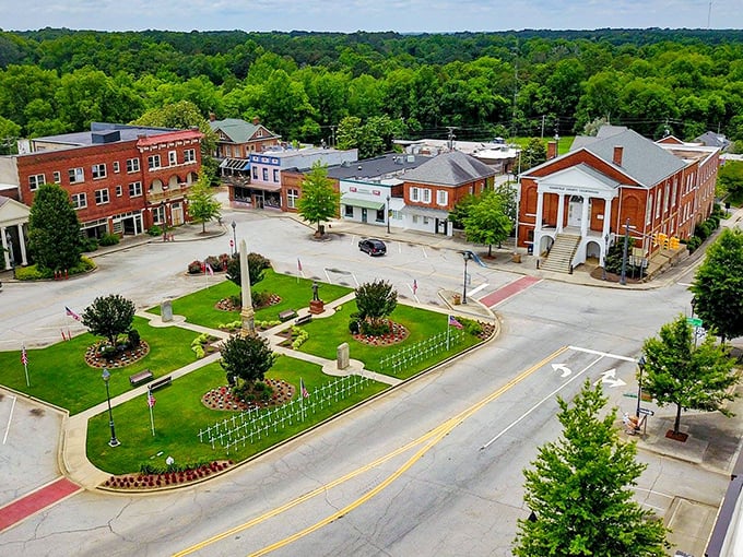 Edgefield's town square at golden hour looks like a Norman Rockwell painting come to life, where brick buildings and green spaces create the perfect small-town symphony.