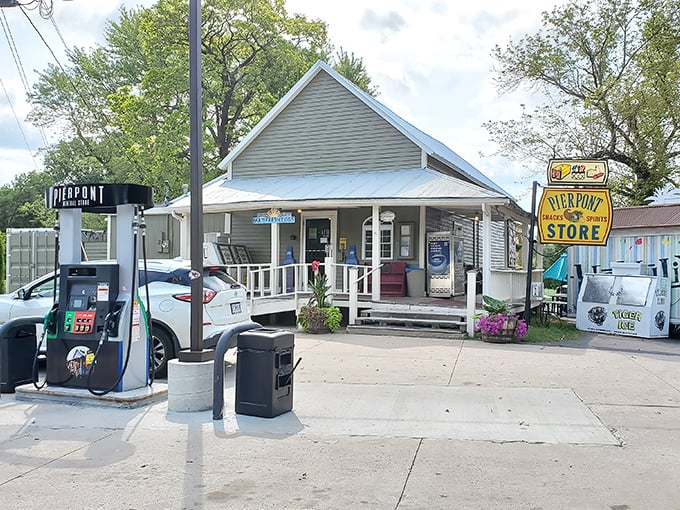 The wooden pergola and hanging flower baskets aren't trying to impress anyone&mdash;they're just being their authentic, charming Missouri self. Pure roadside magic.