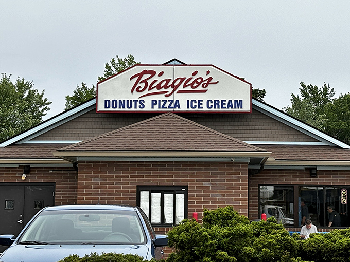 The sign says it all: donuts, pizza, and ice cream. It's like they read my diary and built a business around it.