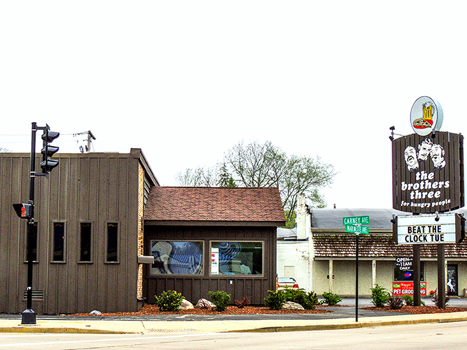 The unassuming exterior of Brothers Three might not scream "culinary destination," but that vintage sign promises what every hungry traveler seeks: satisfaction for hungry people.