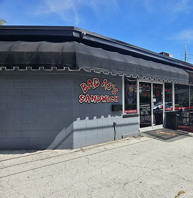 The bold red lettering against gray cinderblock says it all &ndash; this place isn't trying to impress you with fancy decor, just life-changing sandwiches.