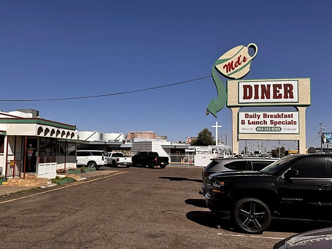 That iconic coffee cup sign isn't just a beacon for hungry travelers—it's a promise of comfort food that delivers on every nostalgic diner dream.