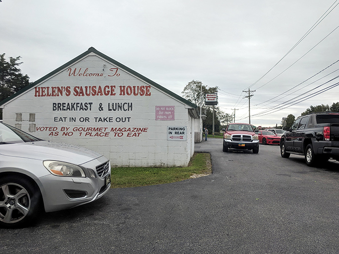 The unassuming white exterior of Helen's Famous Sausage House&mdash;proof that culinary greatness doesn't need fancy architecture, just perfect sausage.