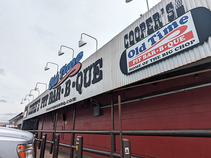 The unassuming red exterior of Cooper's might not scream "food paradise," but in Texas, the best barbecue joints often hide in plain sight.
