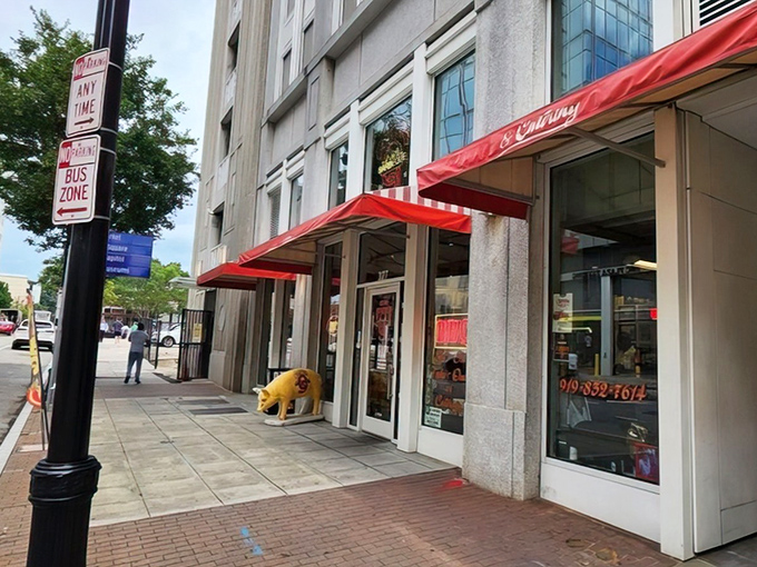 The iconic red awning and pig statue welcome you to Clyde Cooper's &ndash; where barbecue dreams come true since 1938.