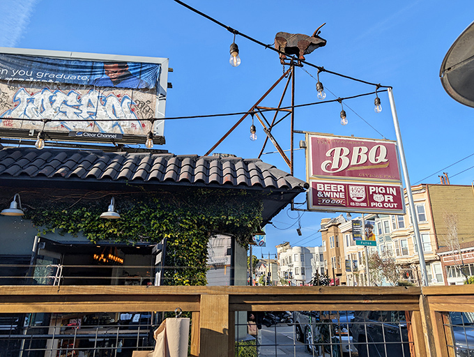 The charming exterior of 4505 Burgers & BBQ beckons with its vintage sign and vine-covered facade&mdash;a carnivore's oasis in San Francisco's urban landscape.