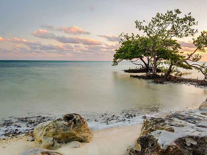 Nature's watercolor palette on full display as the sun bids farewell over the tranquil waters of Anne's Beach. Serenity has never looked so good.