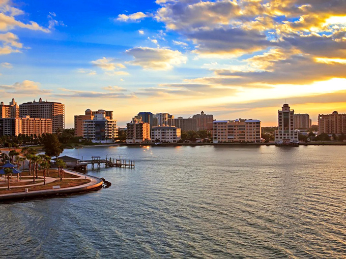 Bradenton's waterfront skyline at sunset looks like Mother Nature decided Florida deserved its own version of golden hour perfection.