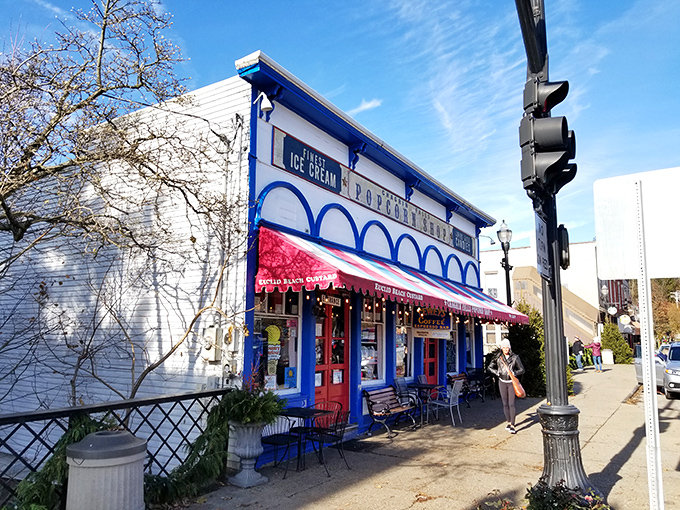 The iconic Popcorn Shop perches precariously over the falls like a blue-and-white sentinel of sweetness, serving ice cream and memories since 1949. 