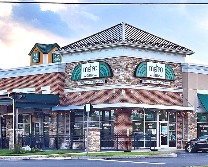 Metro Diner's brick exterior promises comfort before you even step inside, with window signs teasing signature dishes like Shrimp & Grits that'll haunt your food dreams.