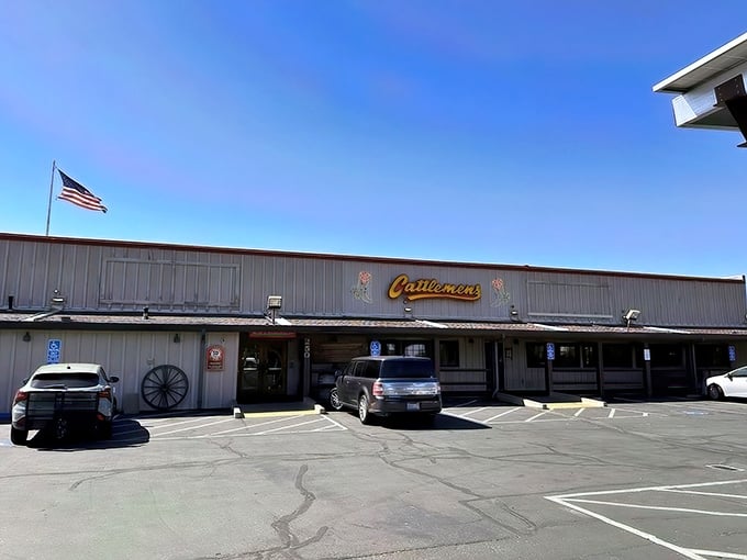 The iconic Cattlemens exterior welcomes hungry travelers with its Western charm and neon cowboy boots. This isn't just dinner&mdash;it's a destination.