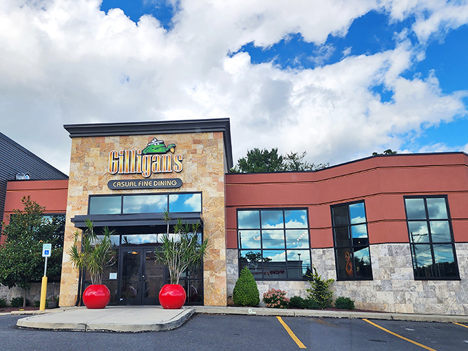 Gilligan's welcoming exterior promises culinary adventures ahead, with stone fa&ccedil;ade and bright red planters setting the stage for what's inside.