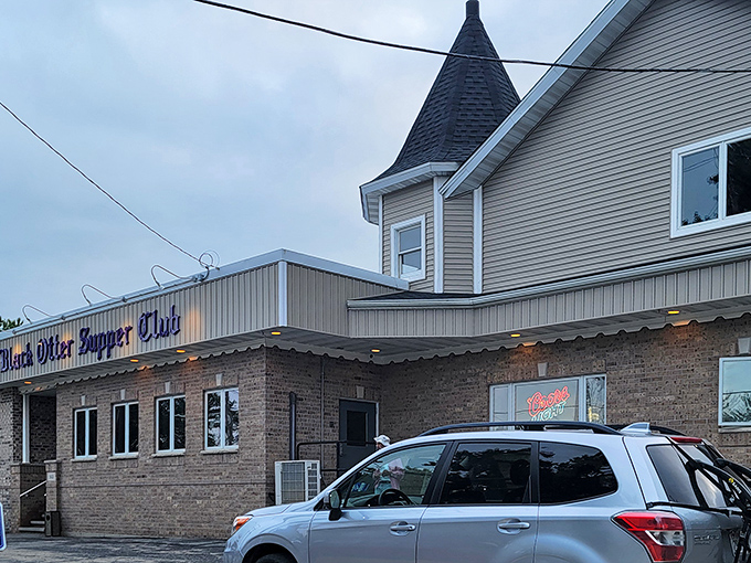 The iconic turret of Black Otter Supper Club stands sentinel over the parking lot&mdash;architectural proof that good taste extends beyond the kitchen.