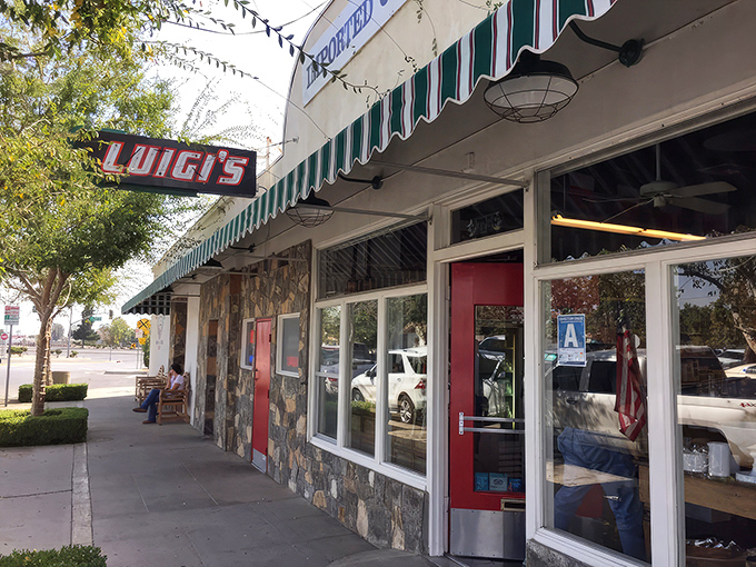 Luigi's classic storefront beckons with its vintage sign and green-striped awning&mdash;a time capsule of Italian-American tradition standing proudly in Bakersfield.