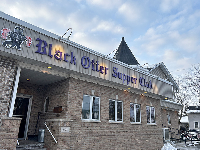 The purple sign beckons like an old friend against the brick facade. Wisconsin supper club perfection awaits inside this Hortonville treasure.