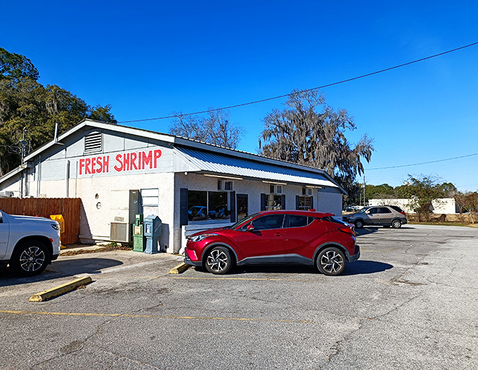 The unassuming exterior of B & J's proudly announces "FRESH SHRIMP" - a simple promise that this coastal Georgia gem delivers on spectacularly.