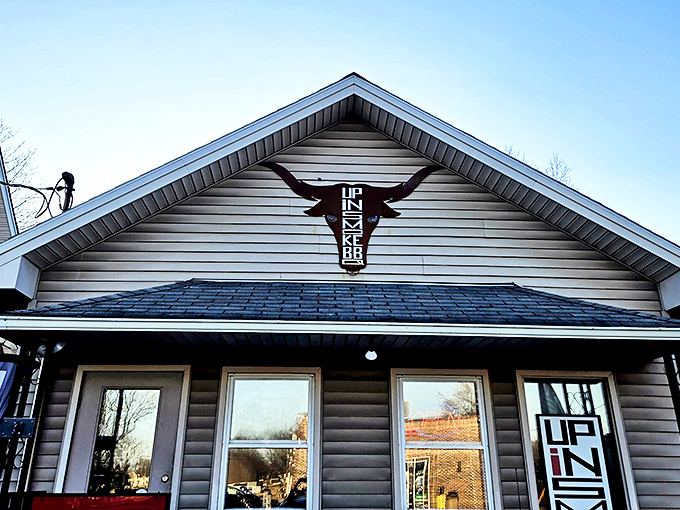 The longhorn logo above this unassuming tan house is like a smoke signal to barbecue lovers &ndash; something magical is happening inside Up In Smoke BBQ. 