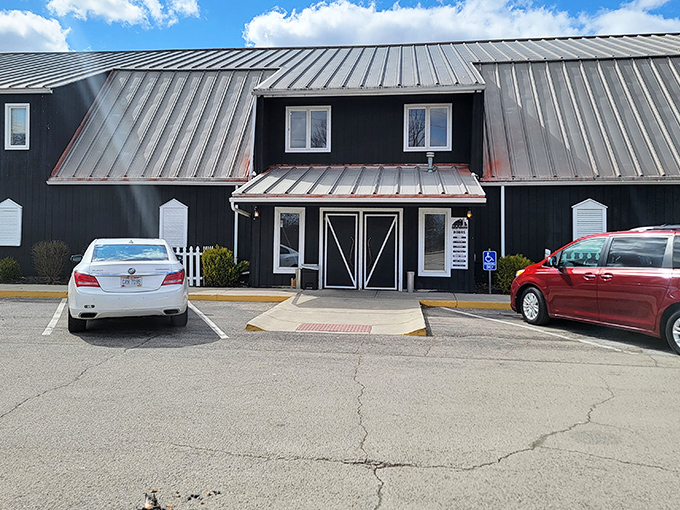 The striking black exterior with classic white trim tells you immediately: this isn't your average roadside eatery, but a culinary destination worth the drive.