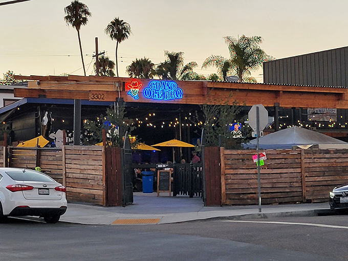 Welcome to barbecue paradise! Grand Ole BBQ's rustic wooden exterior and picnic tables promise the kind of no-frills experience where the food does all the talking.