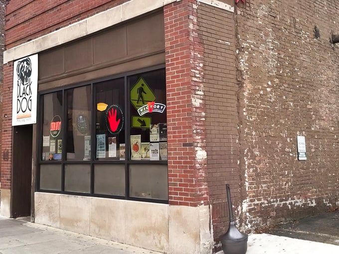 The iconic Black Dog sign beckons like a barbecue lighthouse on Urbana's brick facade. Simple, straightforward, and promising smoky delights within.