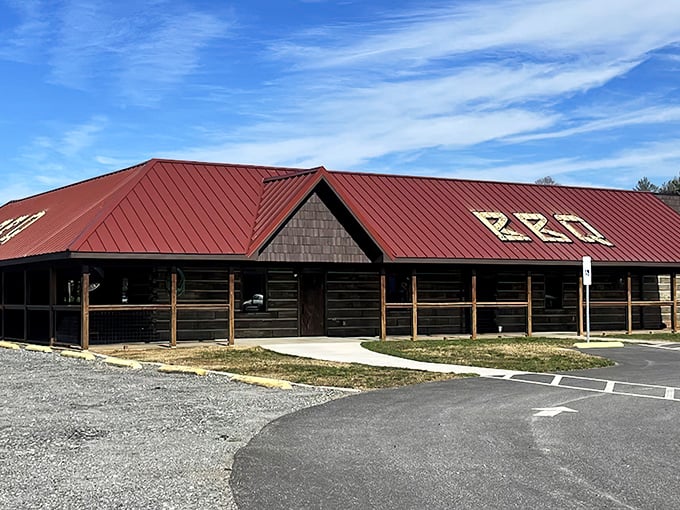 The rustic log cabin exterior with its signature red roof isn't trying to impress anyone&mdash;until you taste what's happening inside.