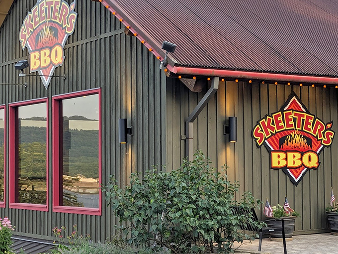 Rustic charm meets serious BBQ business at Skeeter's, where that wooden exterior and fiery logo promise smoky delights within.