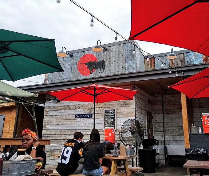 Walter's rustic exterior beckons with string lights and picnic tables, creating a backyard BBQ vibe that says "come hungry, leave happy."