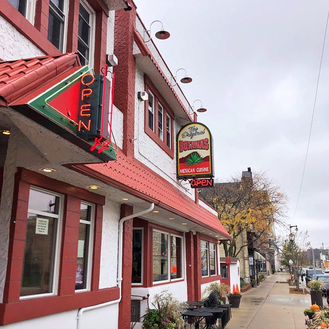 The iconic white building with red trim stands like a beacon of Mexican culinary promise on Milwaukee's South 5th Street. That wooden amigo is just waiting to welcome you inside!
