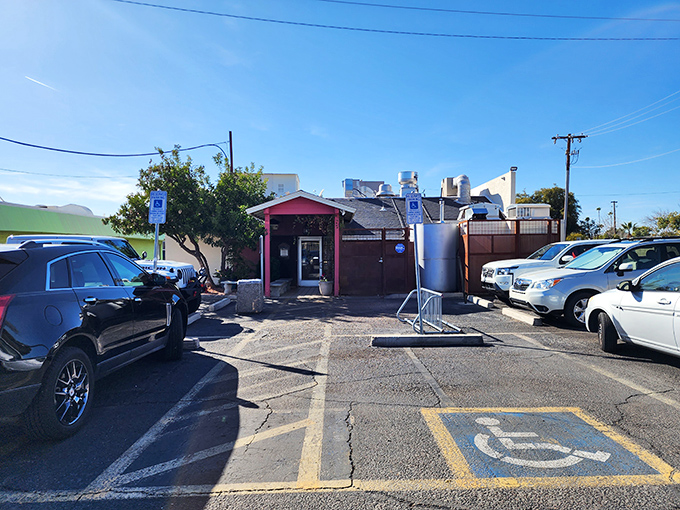 Step inside where geometric pendant lights and warm leather banquettes create the perfect backdrop for serious chimichanga business.