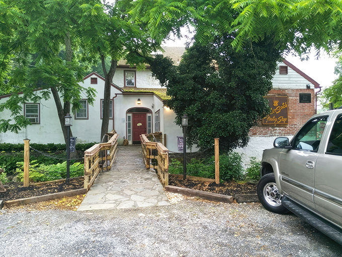 The charming exterior of Butterscotch Pastry Shop feels like stumbling upon a secret clubhouse for carb enthusiasts. The wooden footbridge practically whispers, "Worthy treats await."