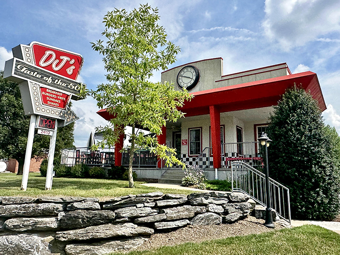The classic neon sign beckons like a time portal to simpler days. DJ's red and white exterior promises nostalgic delights within.