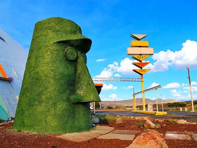 The stoic green guardian of Route 66 stands tall against the Arizona sky, silently judging your life choices and road trip snack selections.