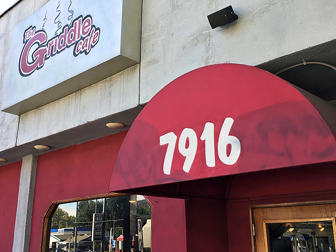 The iconic red awning of The Griddle Cafe beckons hungry Angelenos like a breakfast bat signal. Your pancake destiny awaits behind those doors.
