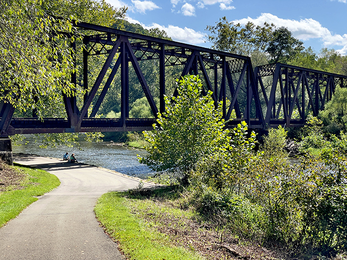 Historic iron bridges span Oil Creek, offering both passage and perspective on this waterway that changed world history.