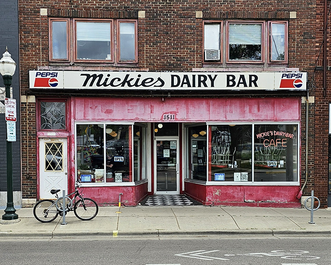 The iconic pink facade of Mickey's Dairy Bar stands as a time capsule on Monroe Street, beckoning hungry Badger fans and locals alike with its vintage charm.